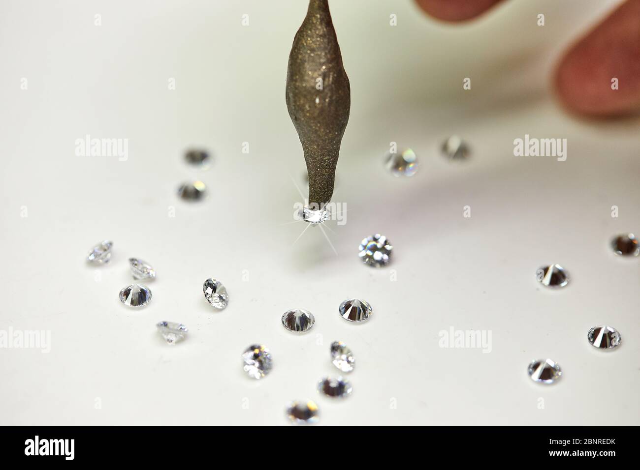 Jewelry production. Special wax setter diamonds on a white background ...
