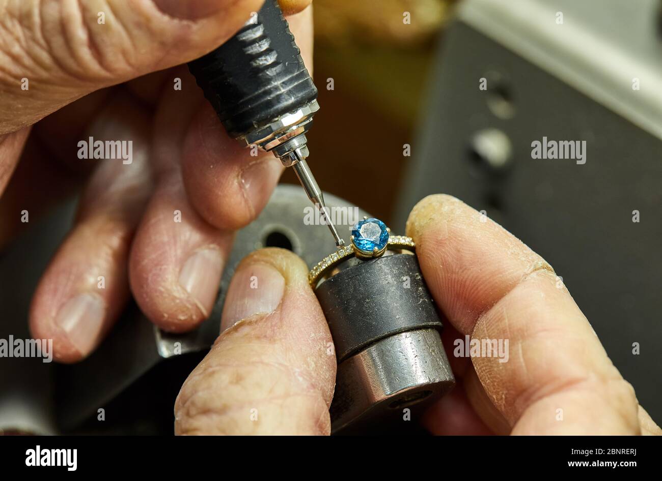Jewelry production. The process of fixing stones with a fixer. Jewelry ...