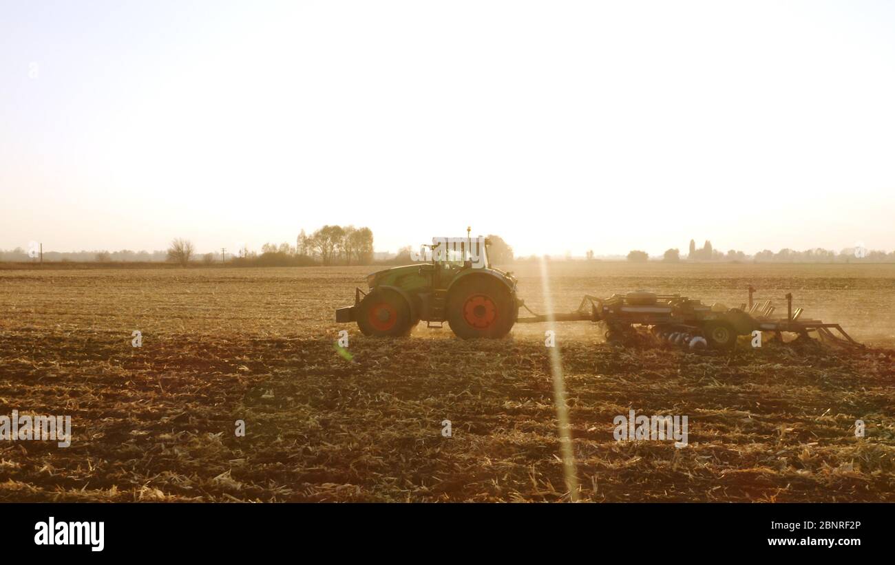 Agricultural machinery plowing large farmland hi-res stock photography ...