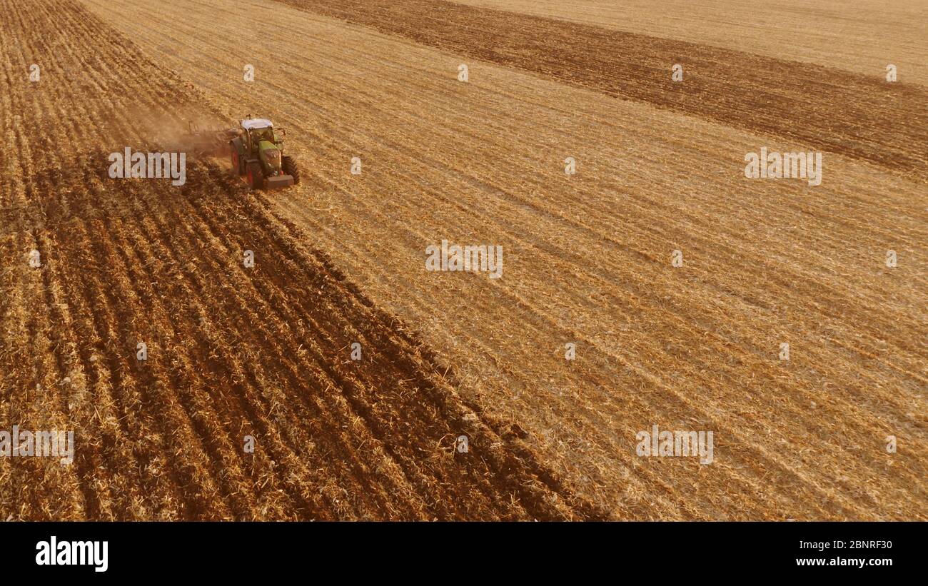 Tractor working on the field, top view Stock Photo - Alamy