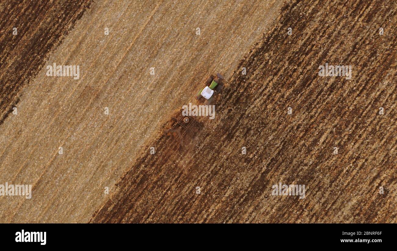 Aerial tractor cultivating sowing field hi-res stock photography and ...