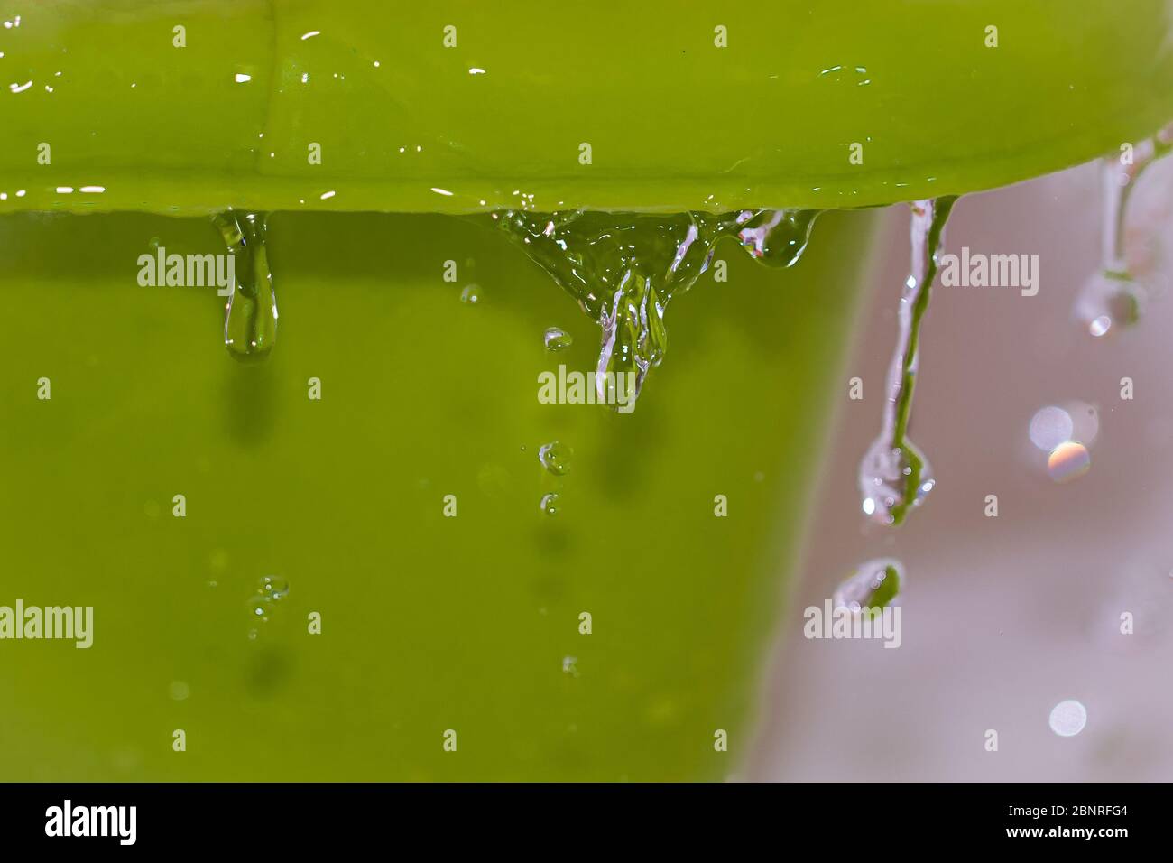 close up of water drops falling from the edge of a basin Stock Photo ...