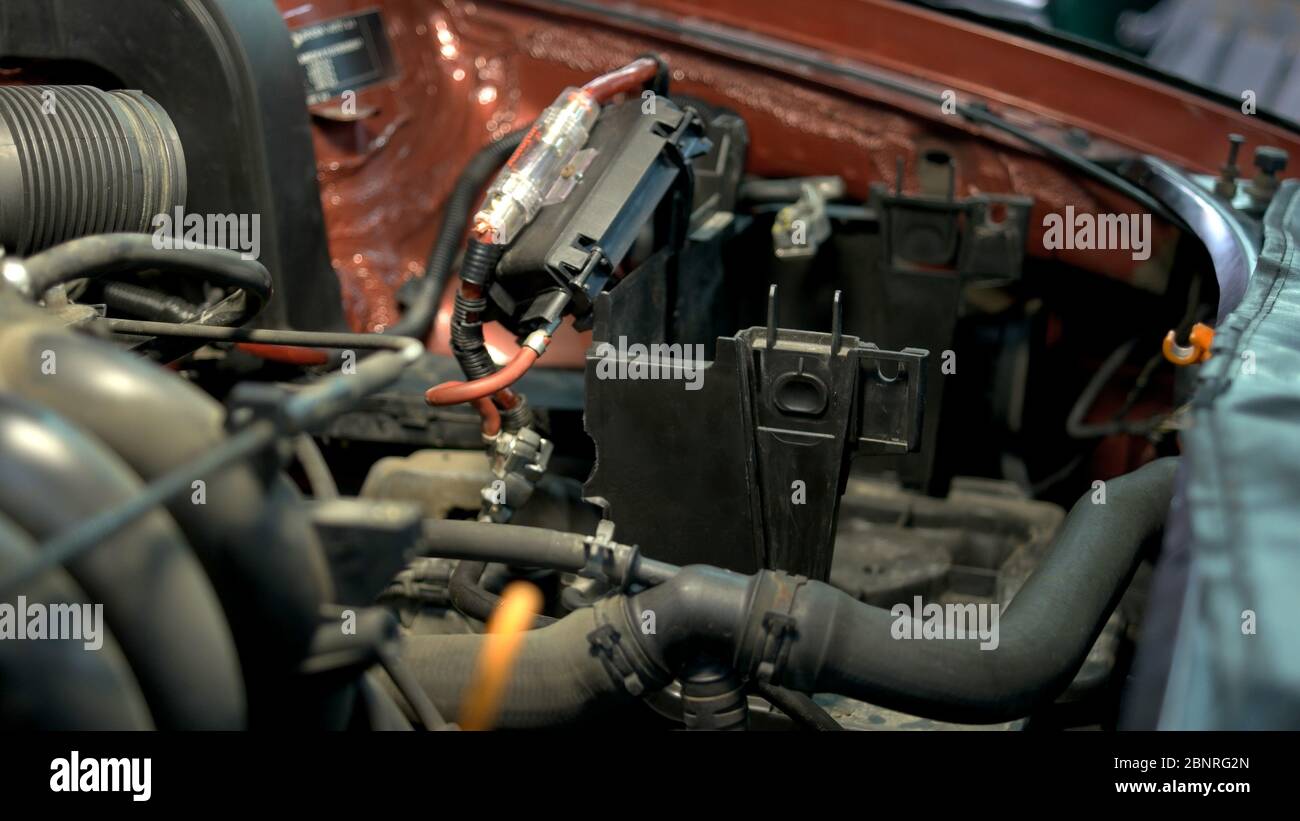 Professional mechanic repairing car engine Stock Photo - Alamy