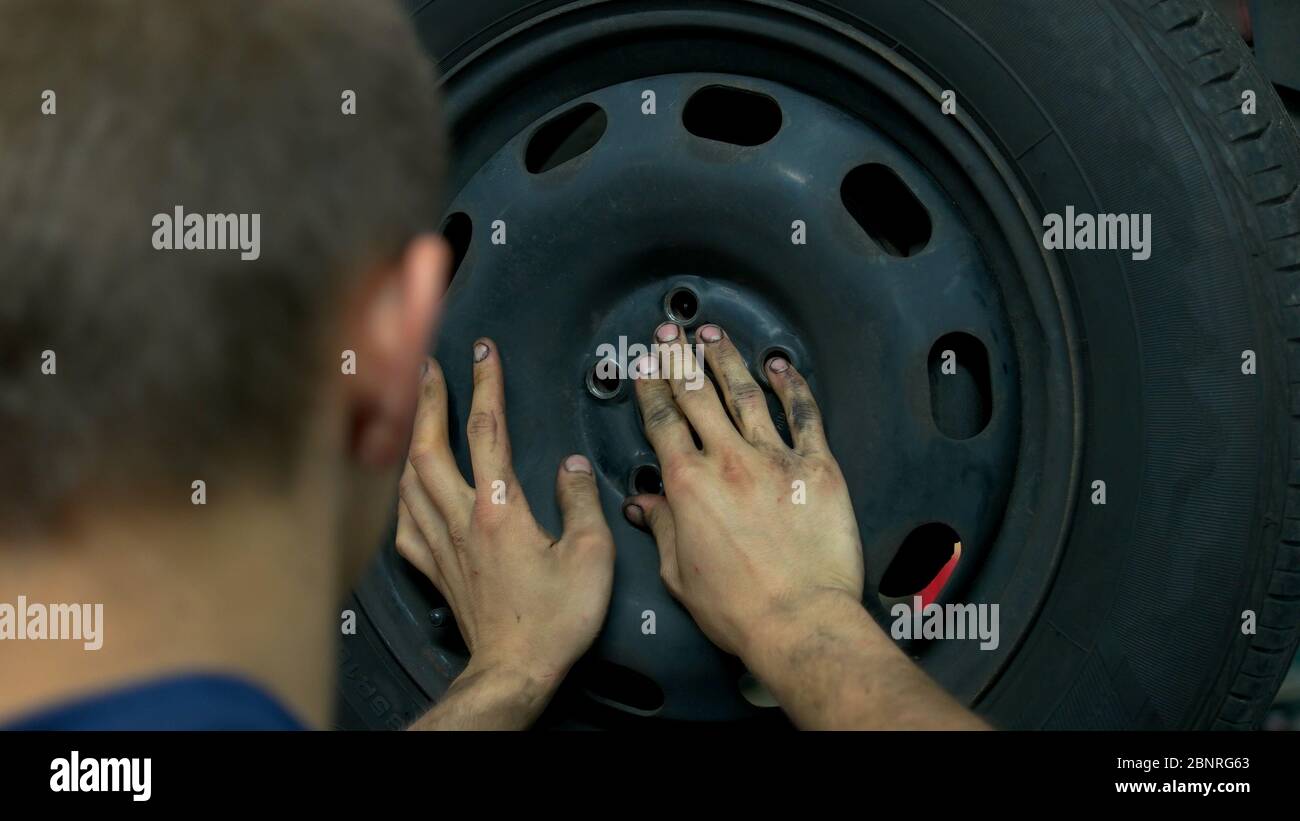 Installing tire hi-res stock photography and images - Alamy