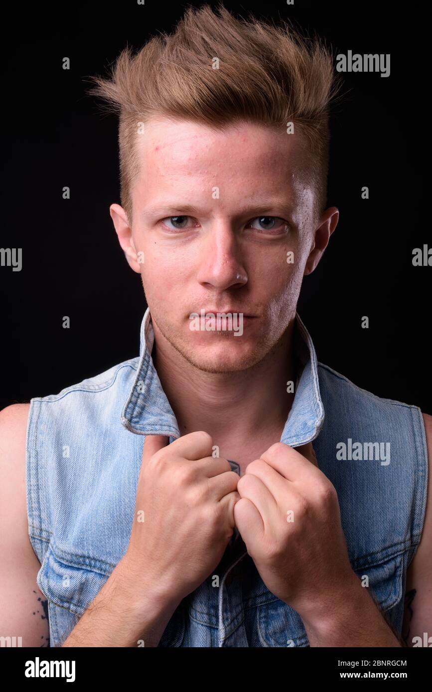Face of rebellious man as punk rocker Stock Photo - Alamy
