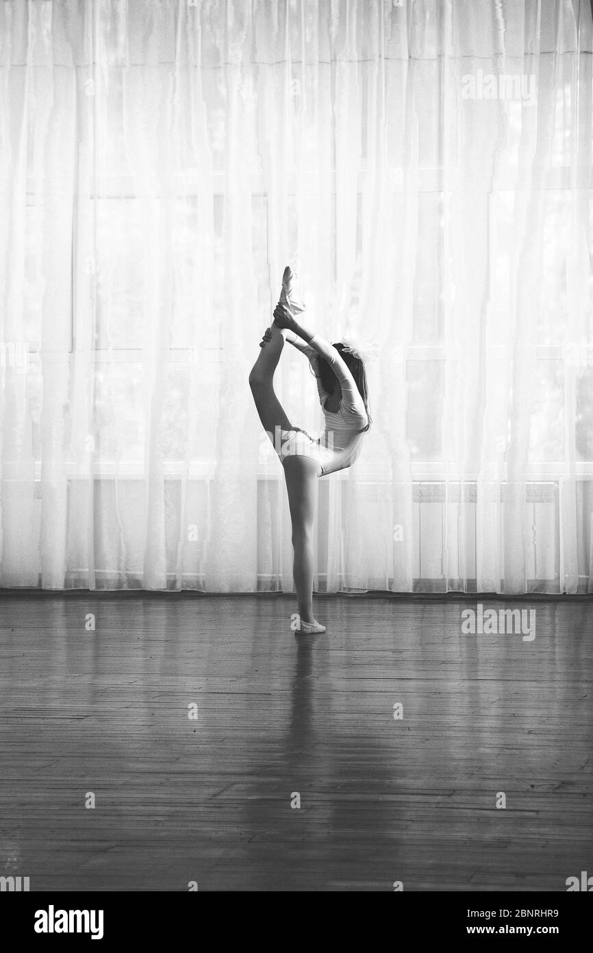 gymnast stands on one leg Stock Photo - Alamy