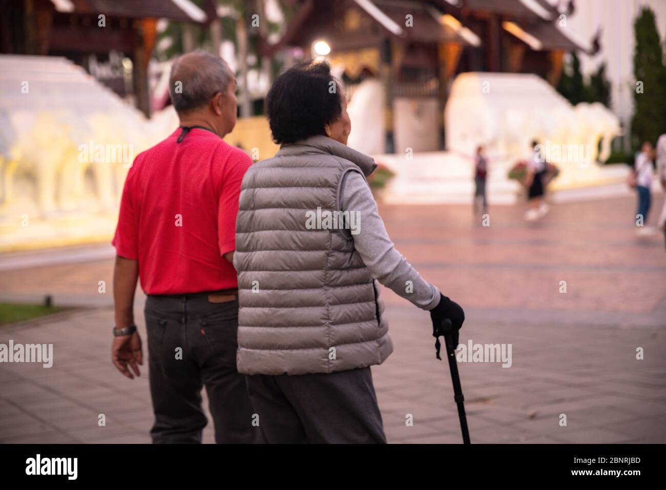 A couple holding hand take an evening walk together Stock Photo - Alamy