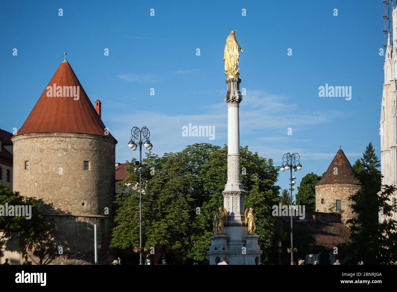 Golden Virgin Mary and four angels statues at Kaptol Square near St ...