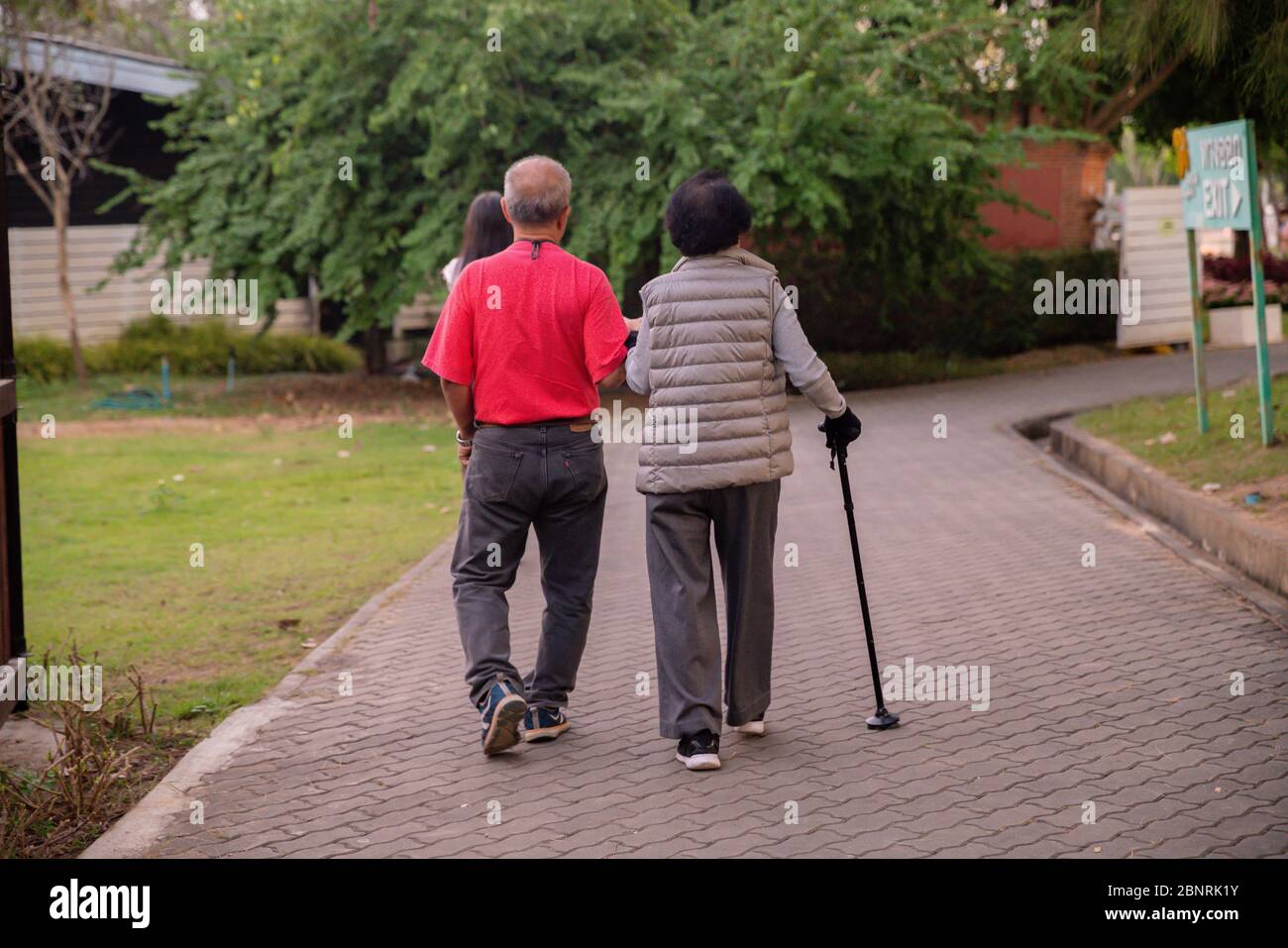 A couple holding hand take an evening walk together Stock Photo - Alamy