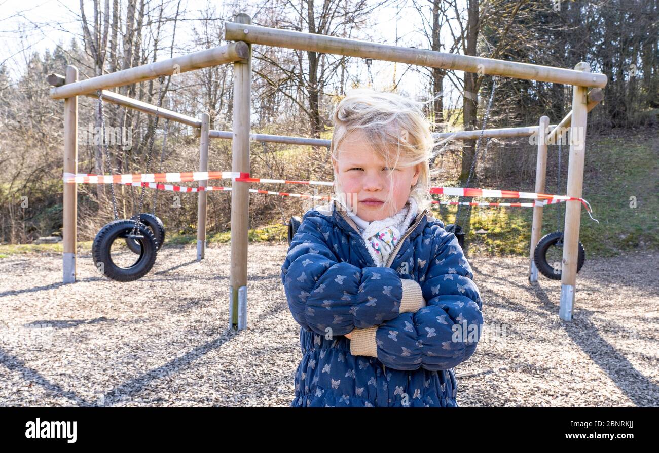 Child in front of a closed playground during the Corona crisis 2020 ...