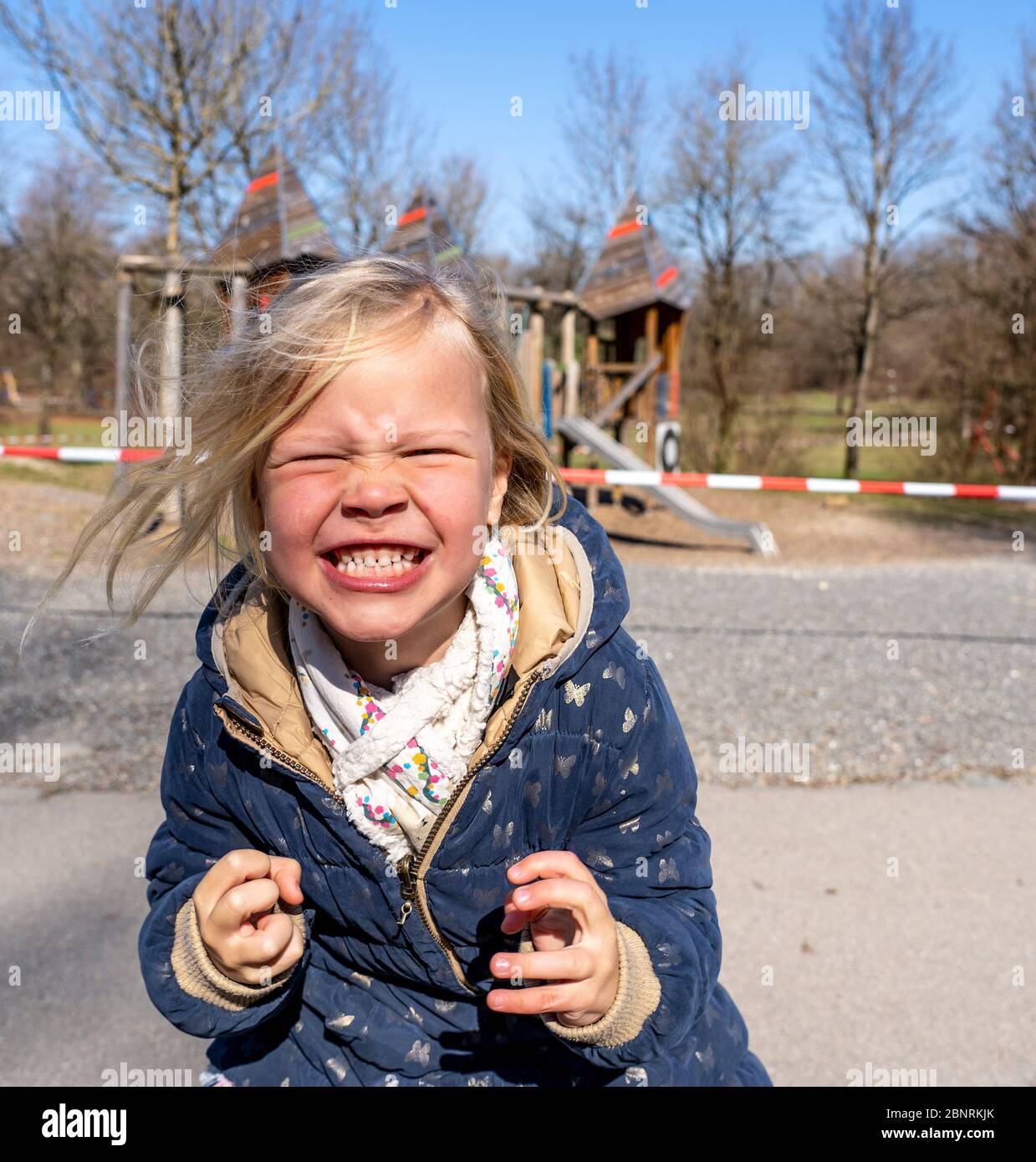 Child standing alone in playground hi-res stock photography and images ...