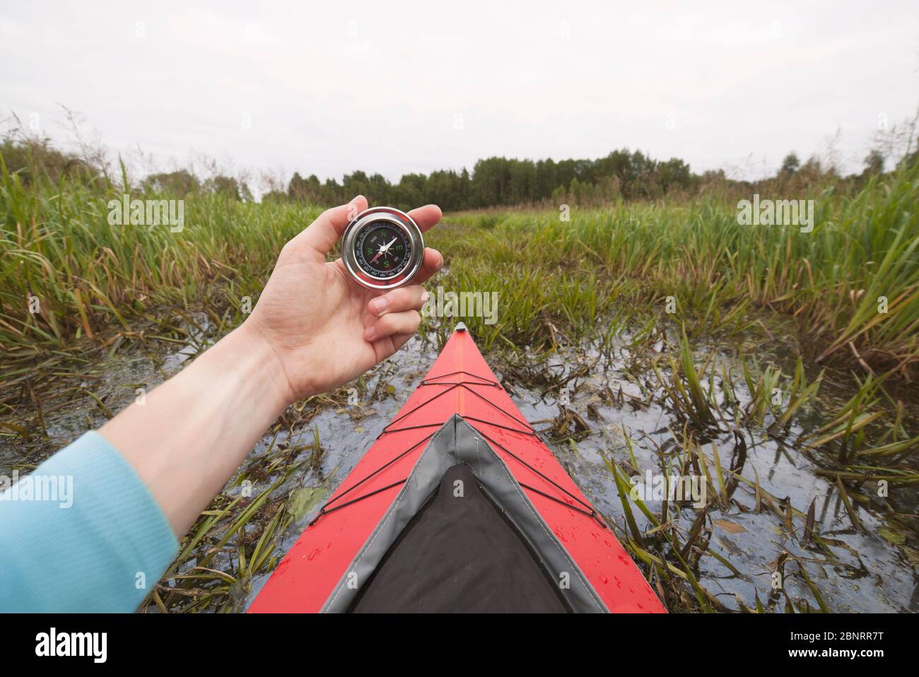 Kayaker with compass lost way Stock Photo - Alamy