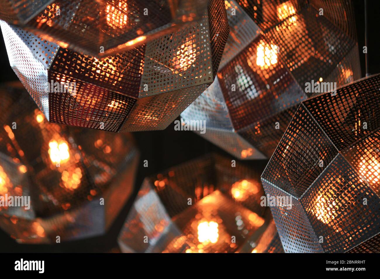 Randomly decorated modern metal pendant lamp shade Stock Photo - Alamy