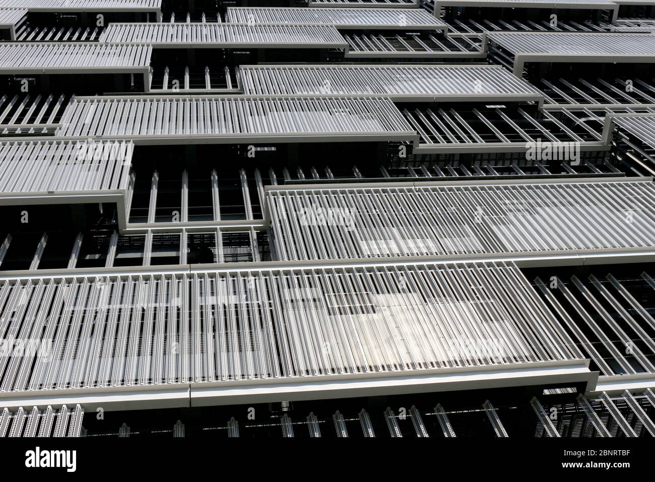 Building exterior decorated with mesh metal grid boards Stock Photo - Alamy