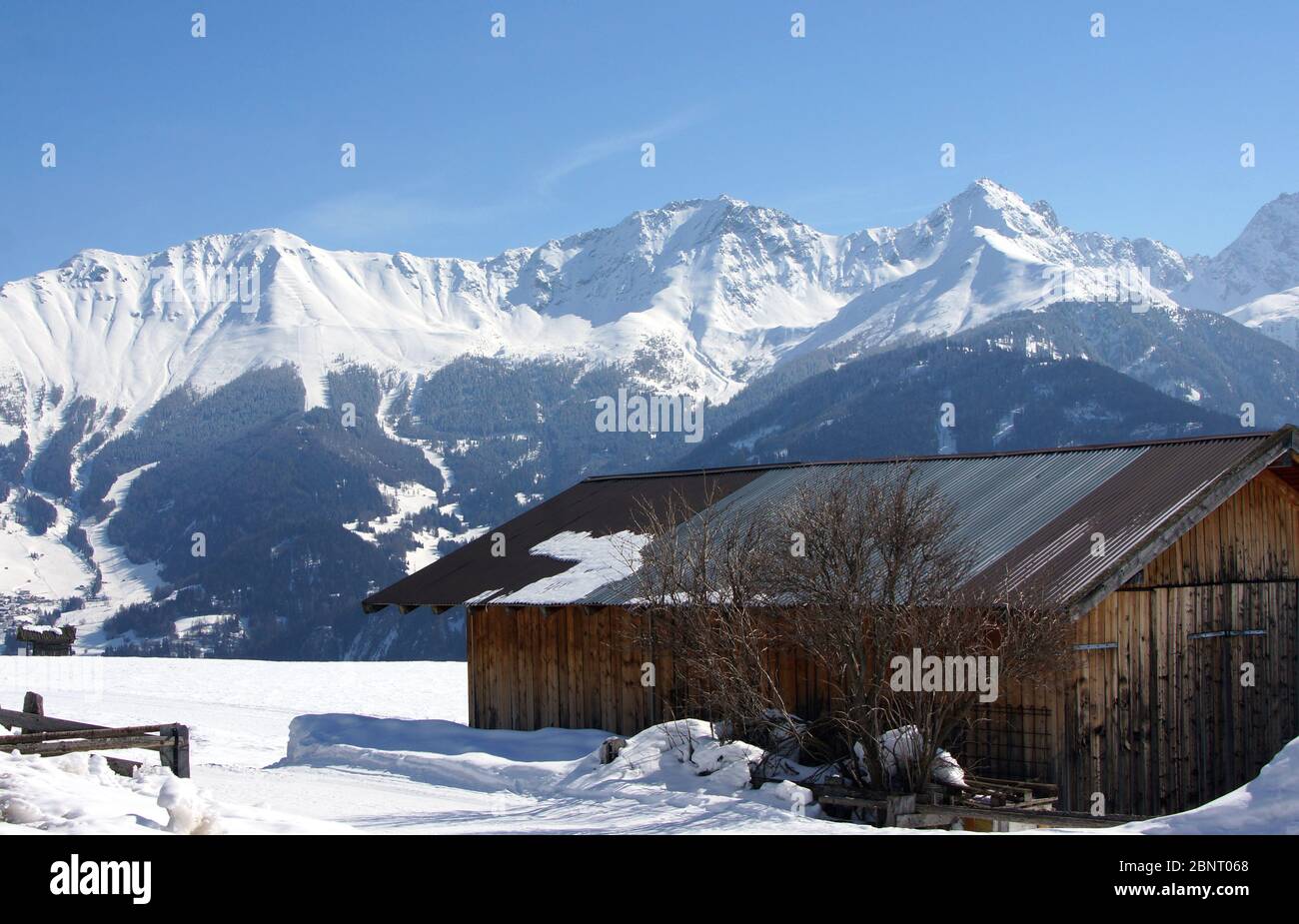 Small Barn in the snow covered alps Stock Photo - Alamy