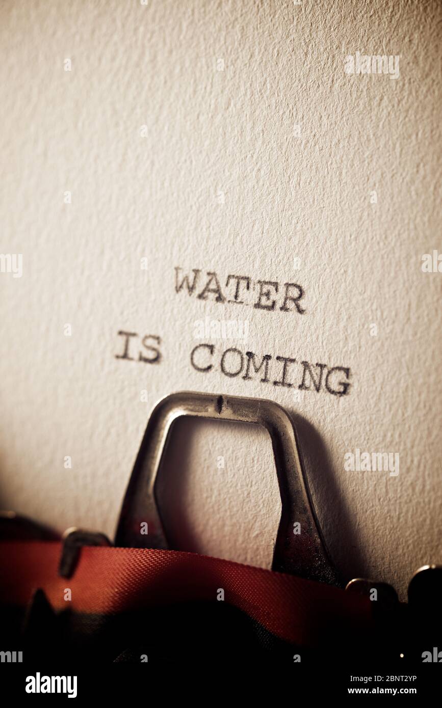The sentence, water is coming, written with a typewriter Stock Photo ...