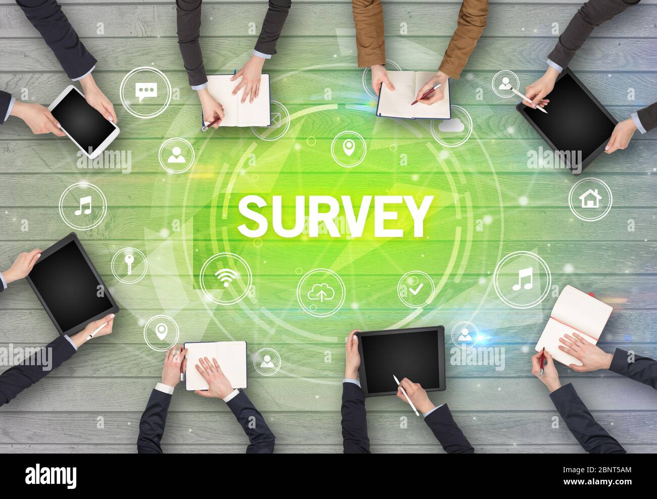 Group of people having a meeting with SURVEY insciption, social ...