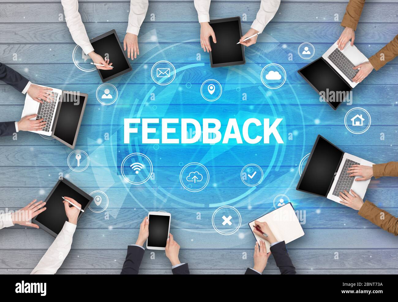 Group of people having a meeting with FEEDBACK insciption, social ...