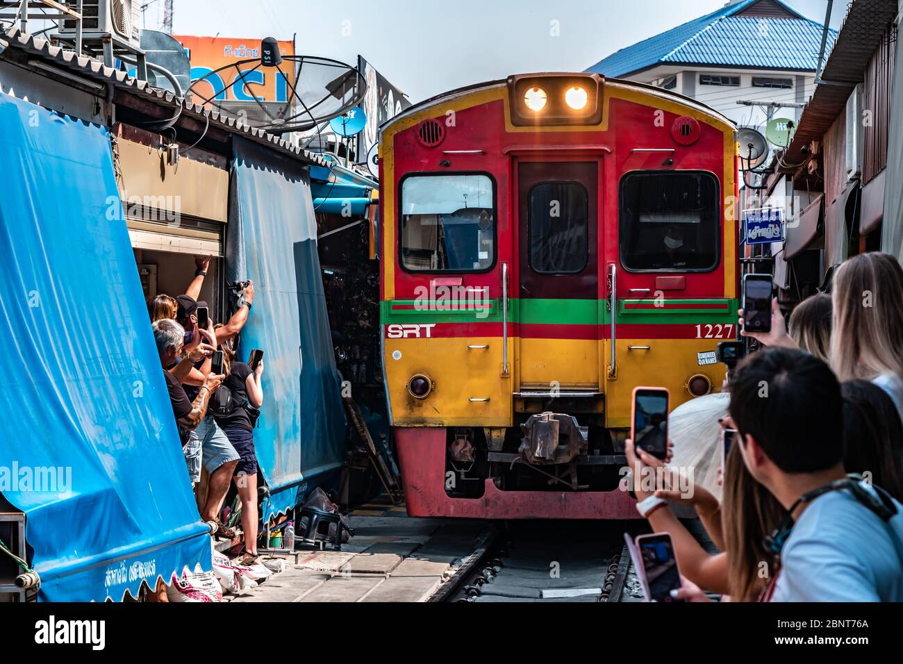 Mae Klong / Thailand - February 11, 2020: Name of this place Maeklong Railway Market or known as ...