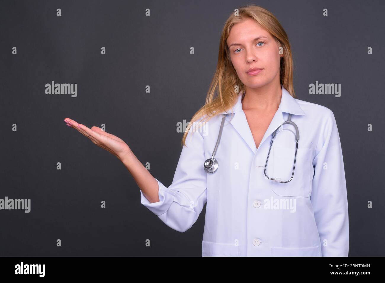 Young woman doctor stethoscope hand hi-res stock photography and images ...