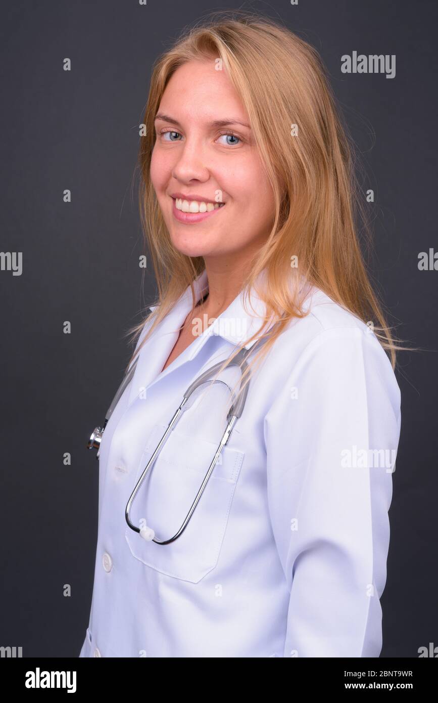 Happy young female doctor hi-res stock photography and images - Alamy