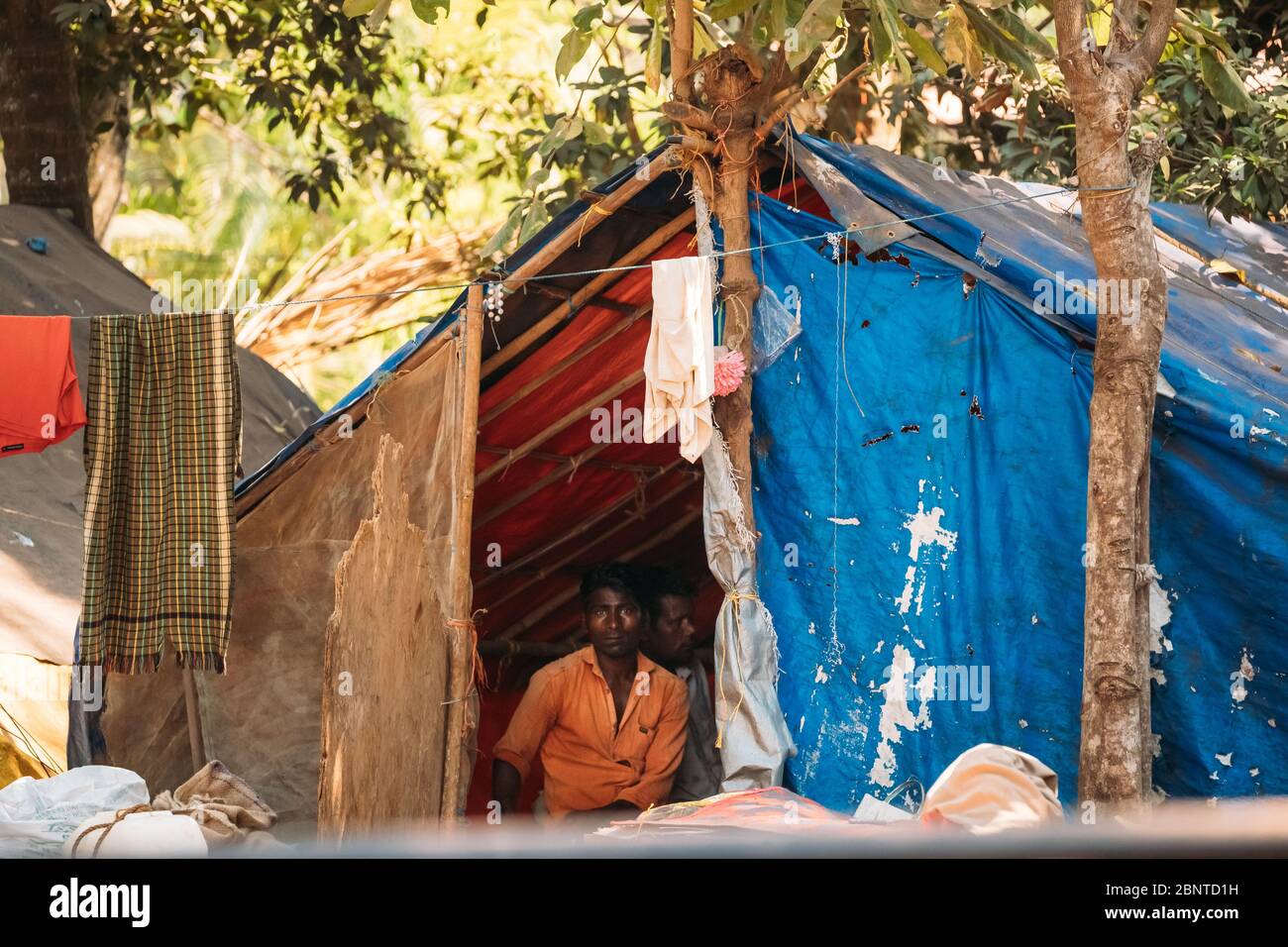 Old Goa, India - February 19, 2020: Unemployed people live in tents on ...