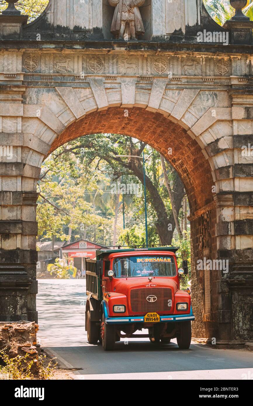 Old Goa, India - February 19, 2020: Red Truck Moving Through The Old ...