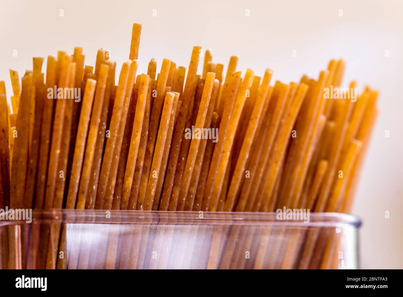 Yellow long spaghetti in container hi-res stock photography and images ...