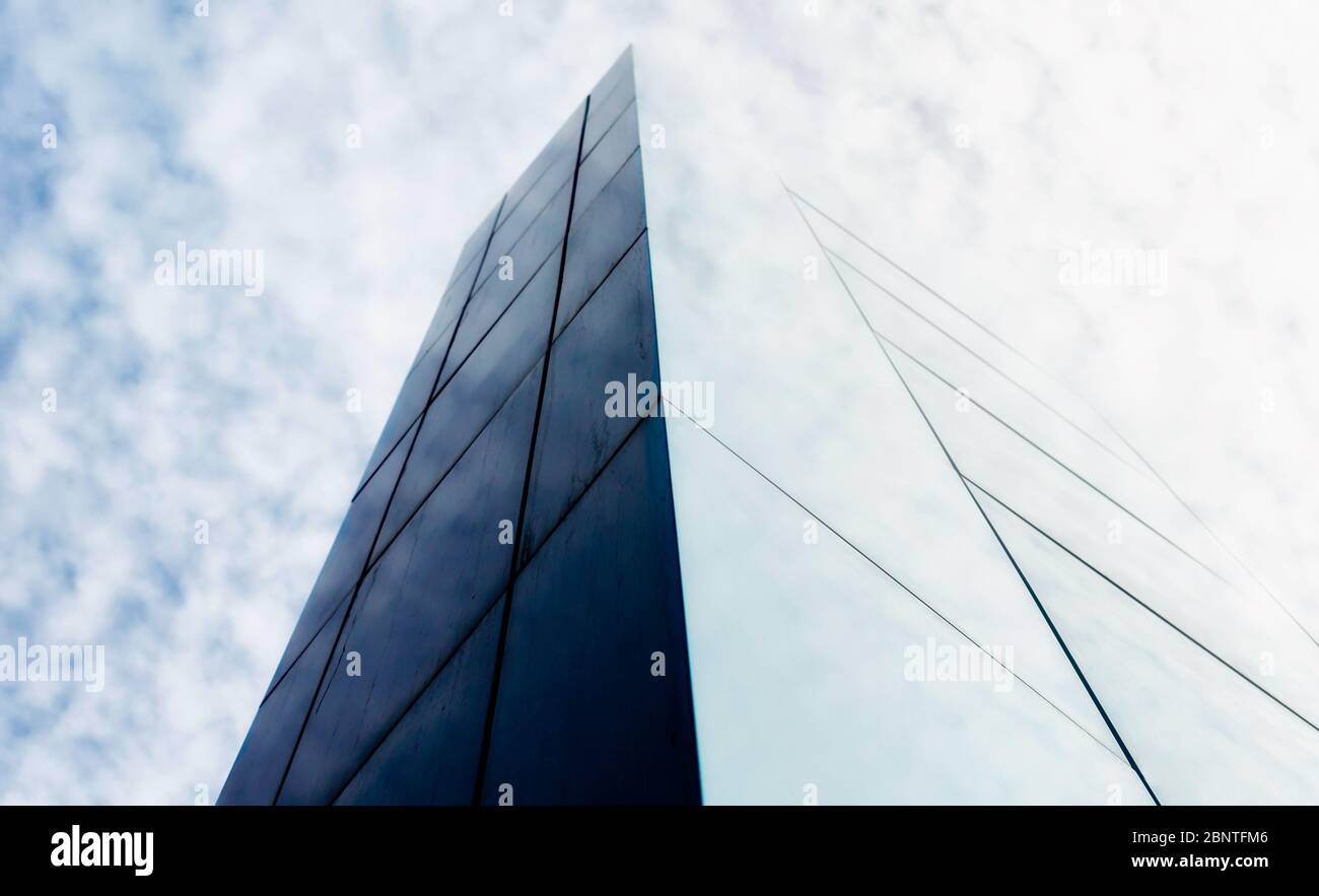 wall of a modern building against the sky and clouds abstract ...
