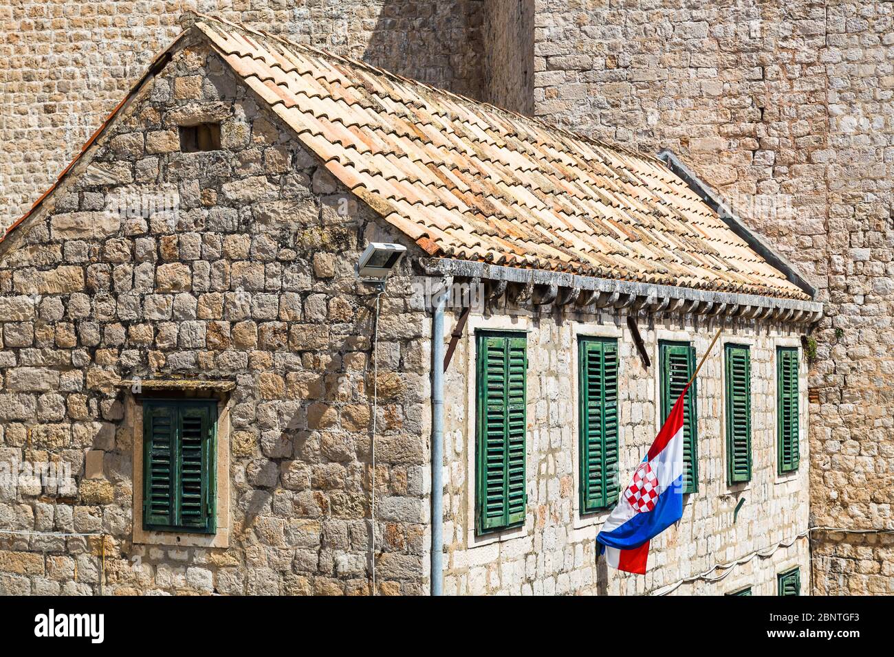 Croatian flag by a rustic building in Dubrovnik seen in May 2017 Stock ...