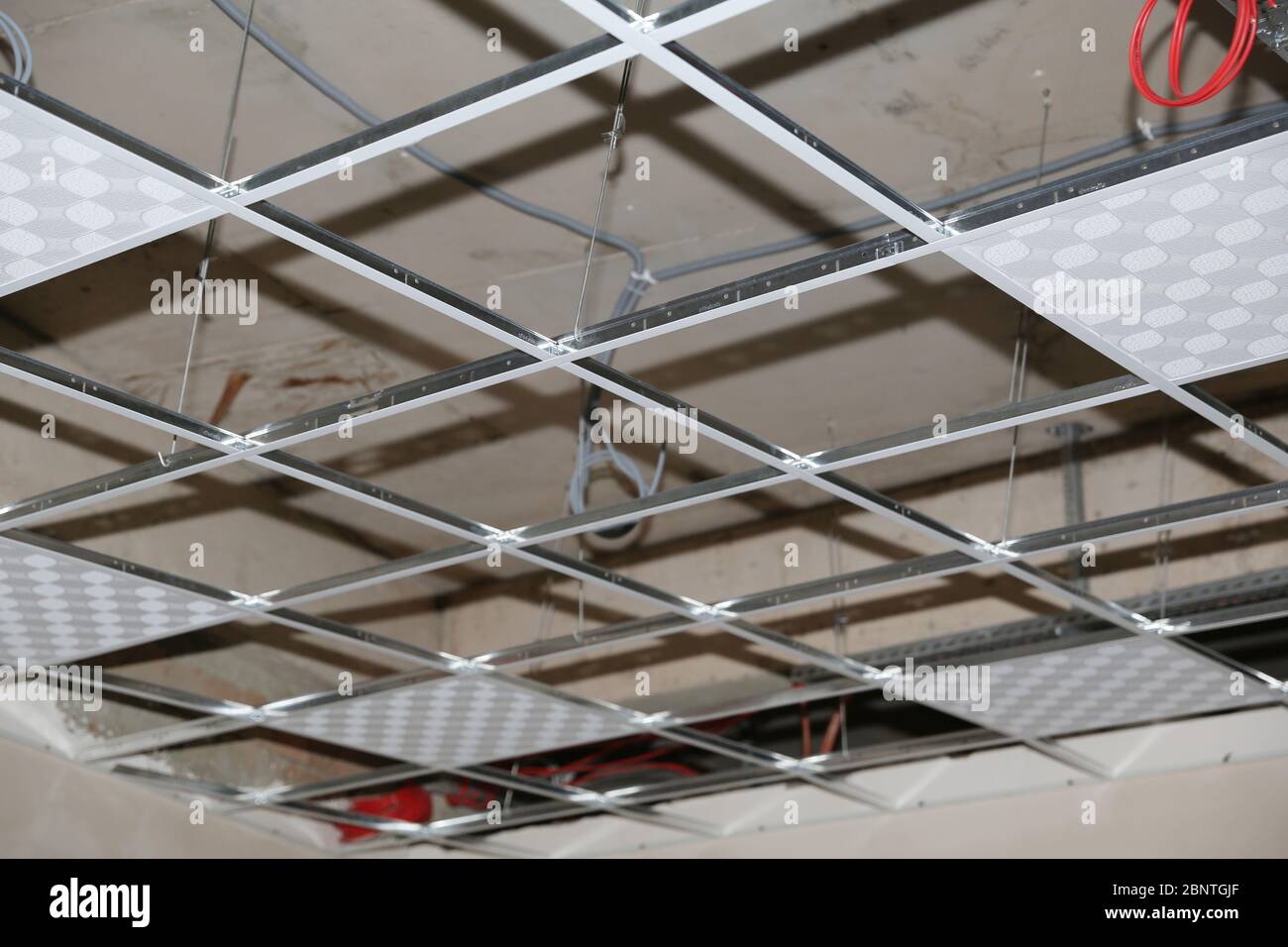 Installation of suspended ceilings and lighting Stock Photo - Alamy