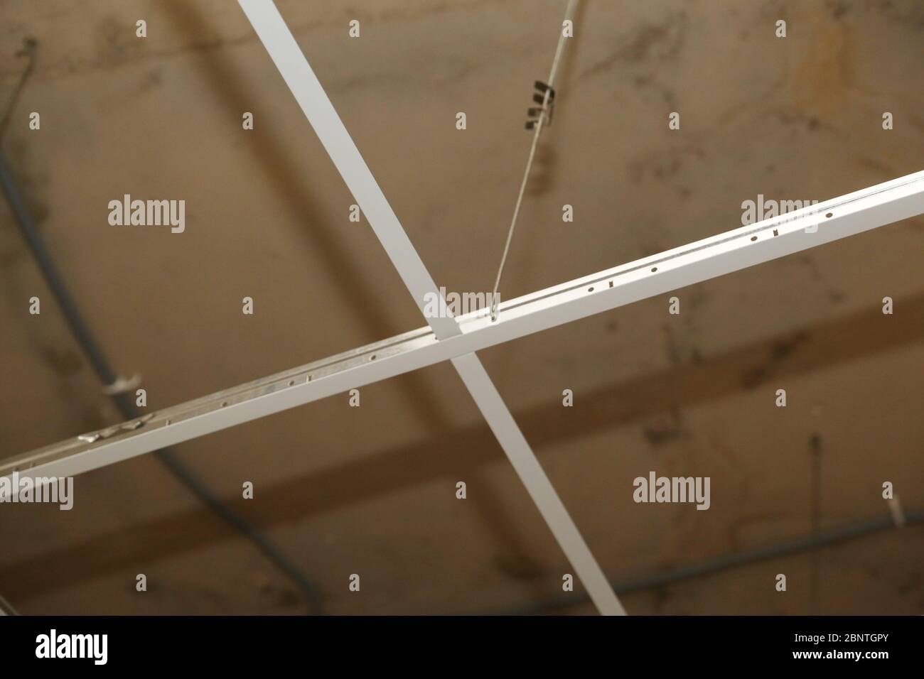 Installation of suspended ceilings and lighting Stock Photo - Alamy