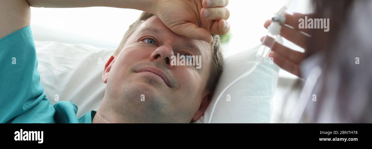 Sick patient taking droppers Stock Photo - Alamy