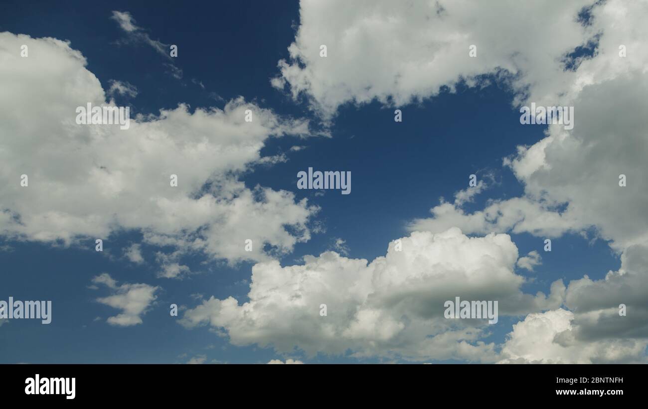 Blue sky with clouds background. Wide view Stock Photo - Alamy