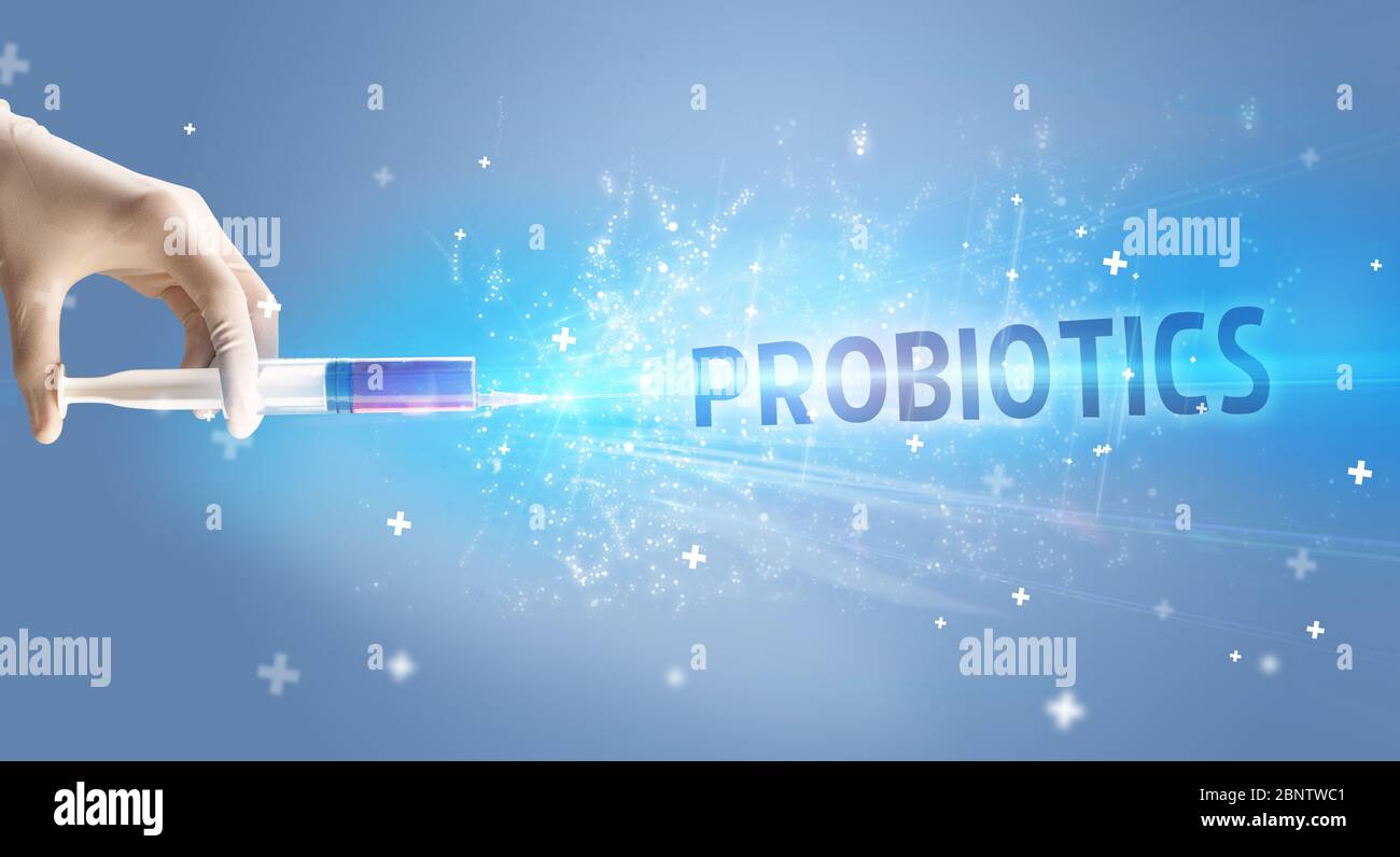 Syringe, medical injection in hand with PROBIOTICS inscription, medical ...