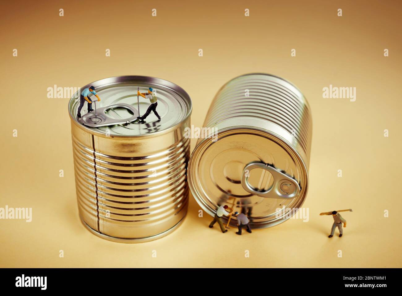 Group of workers opening a tin can with crowbar Stock Photo - Alamy