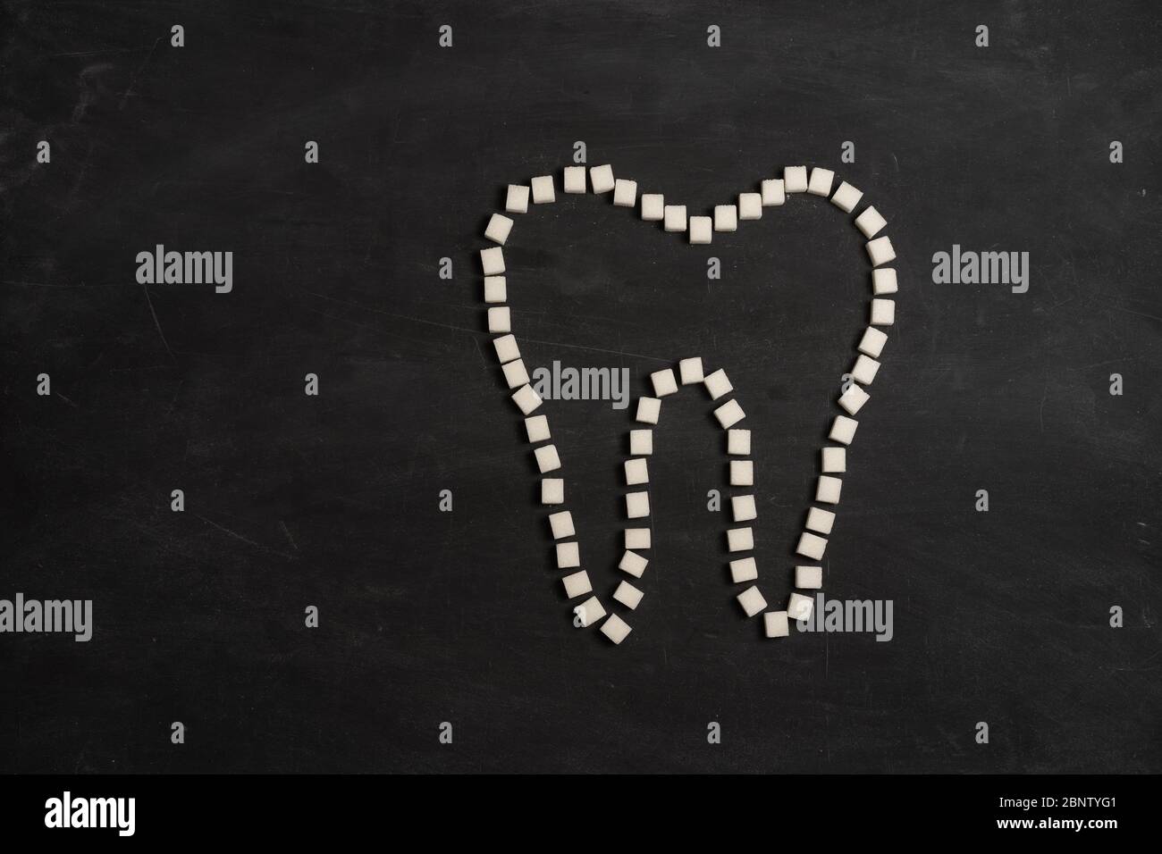 Sugar destroy tooth enamel leads tooth decay White Sugar cubes shape ...