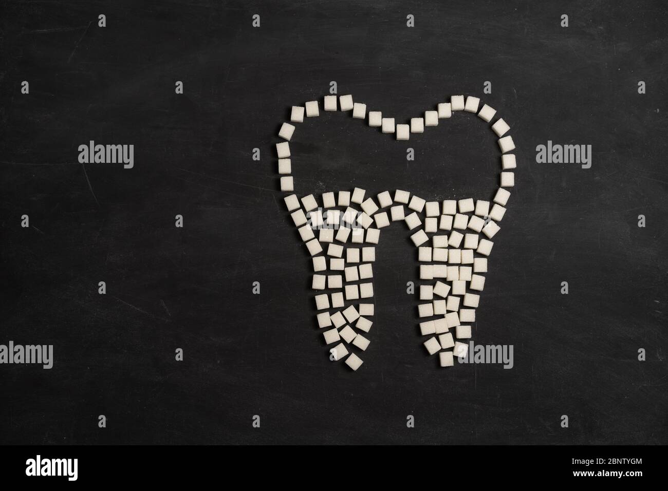 Sugar destroy tooth enamel leads tooth decay White Sugar cubes shape ...