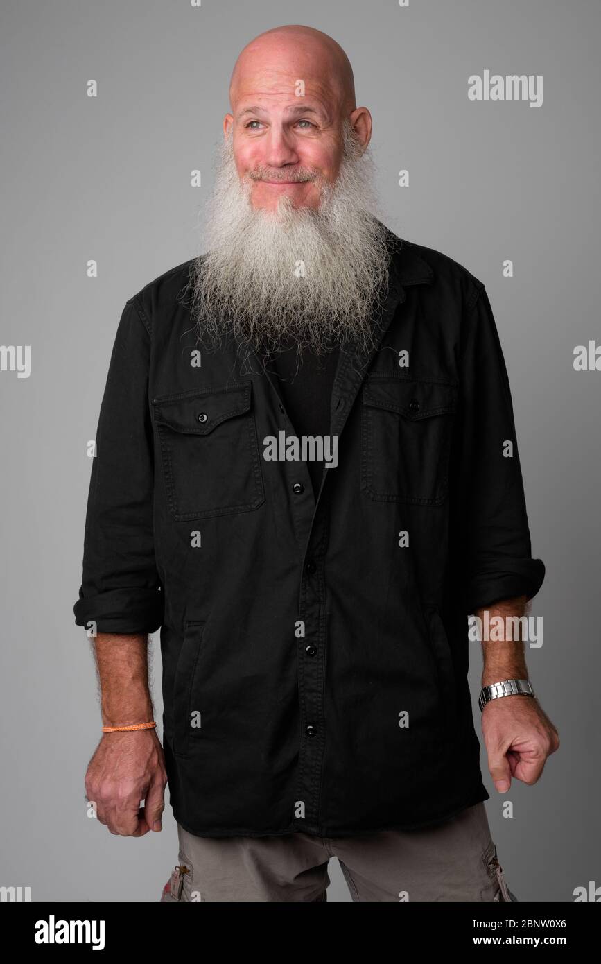 Happy mature bald man thinking hi-res stock photography and images - Alamy