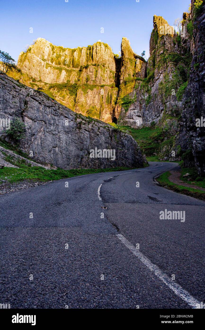 The steep cliffs of Cheddar Gorge viewed from the road (portrait format ...