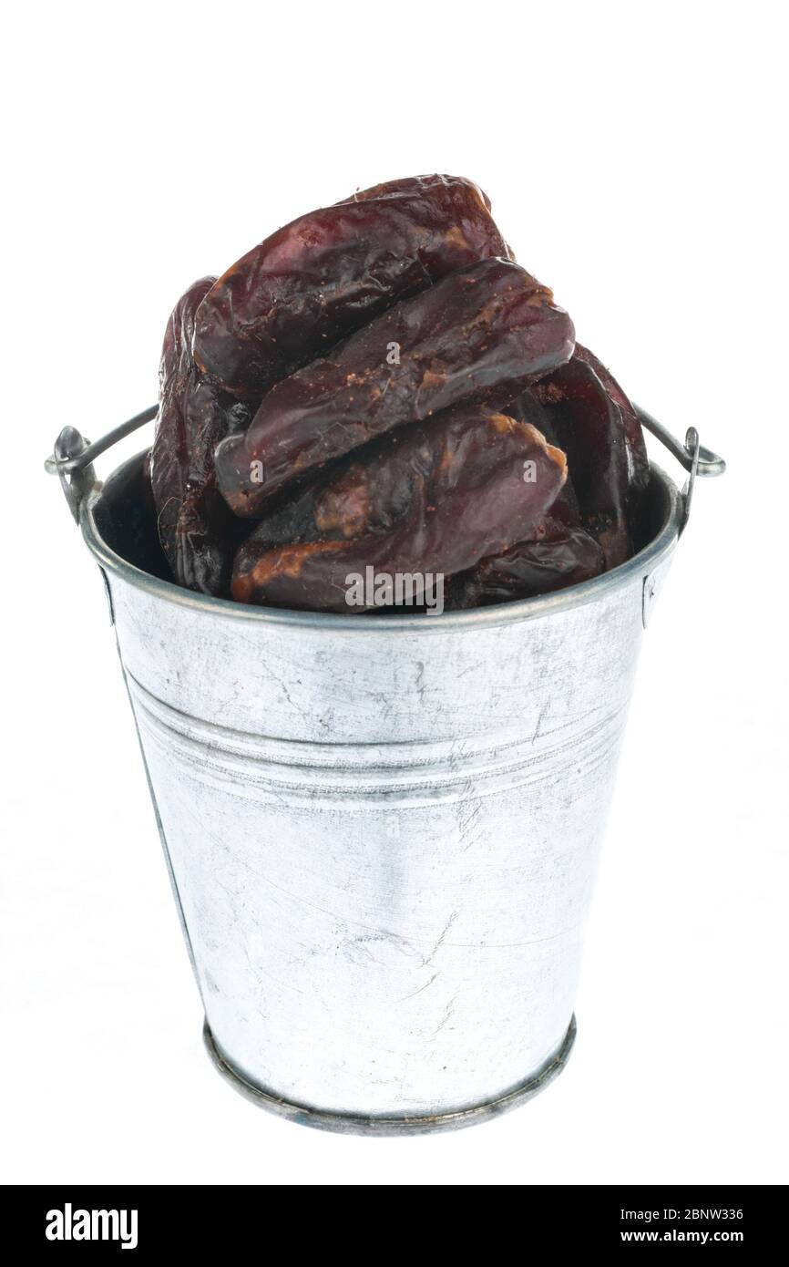 Full bucket of dates on a white background. With place for text Stock ...