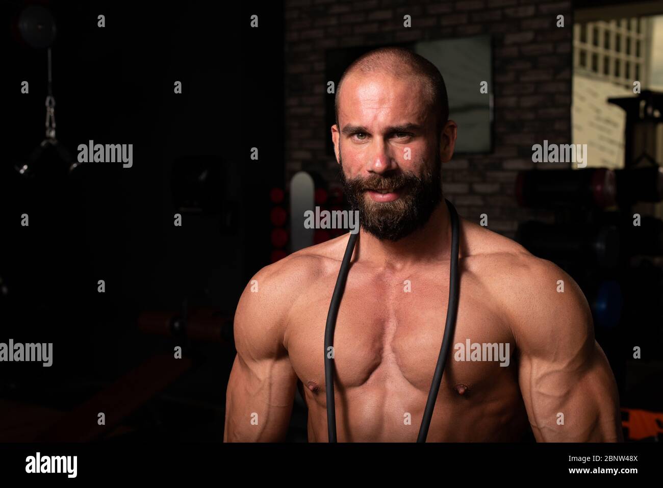 Handsome Muscular Man With Jumping Rope in the Gym Stock Photo - Alamy