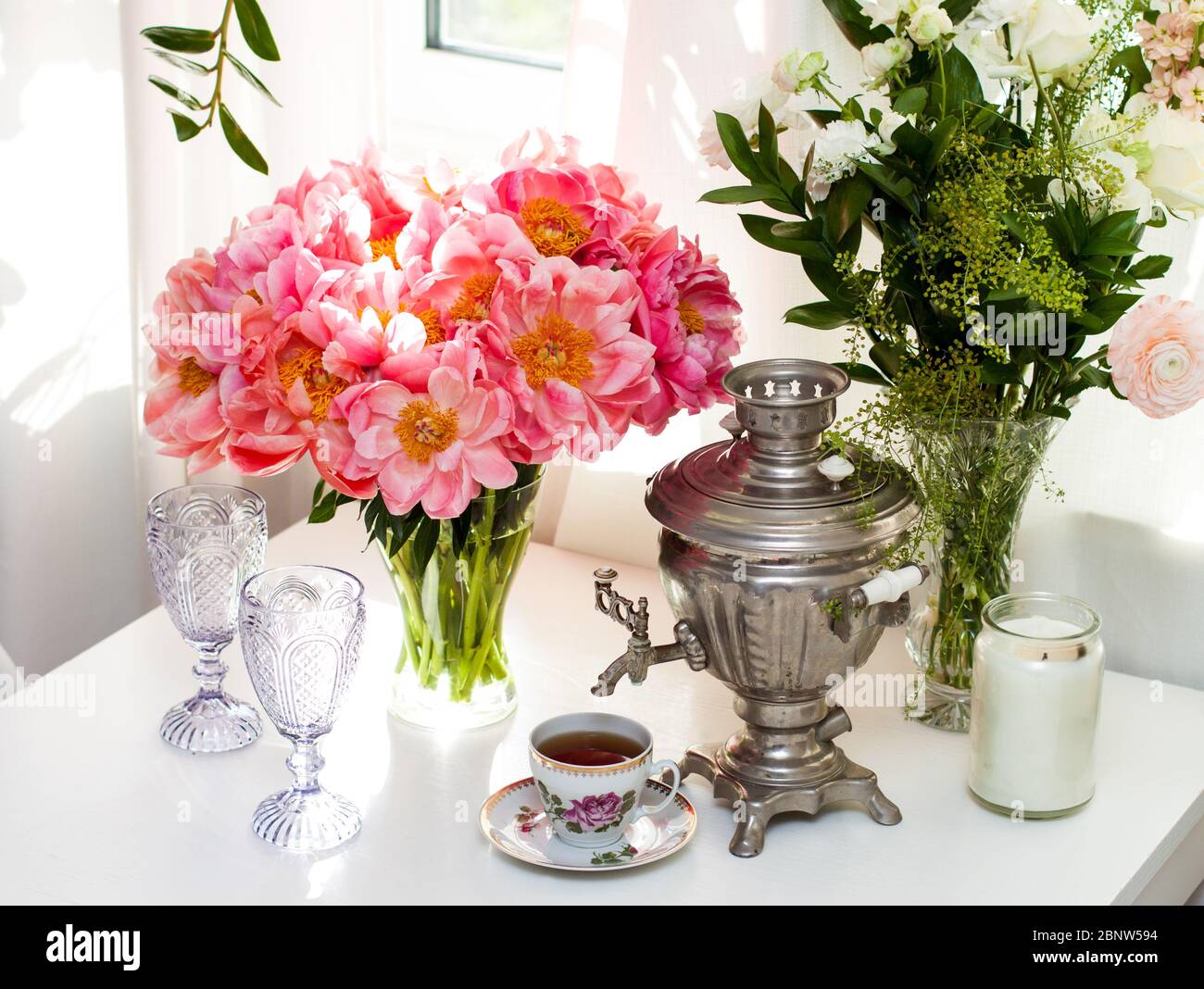 Still life with old russian samovar, rustic cup of tea, bouquet with ...