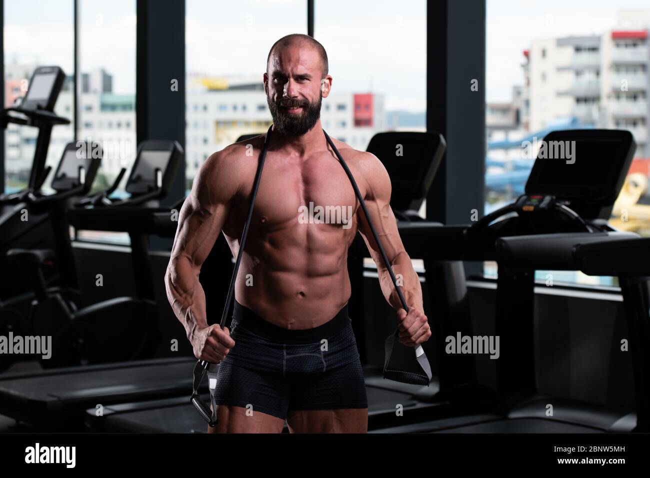 Handsome Muscular Man With Jumping Rope in the Gym Stock Photo - Alamy