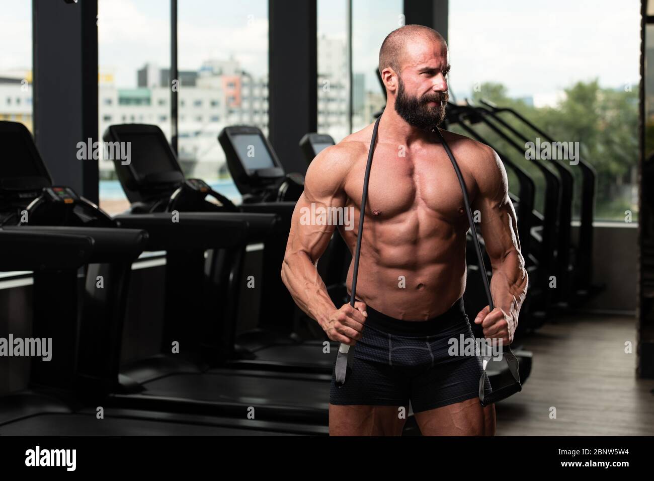 Handsome Muscular Man With Jumping Rope in the Gym Stock Photo - Alamy
