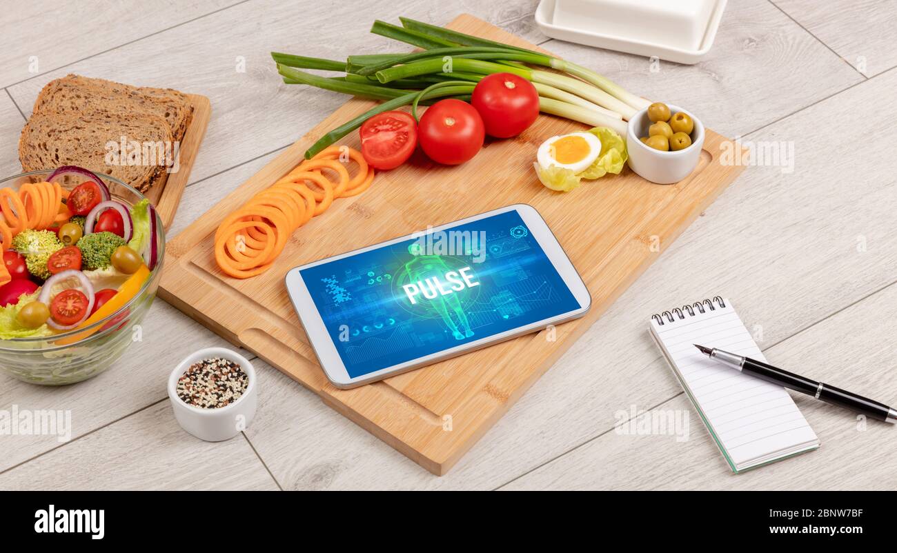 PULSE concept in tablet with fruits, top view Stock Photo - Alamy