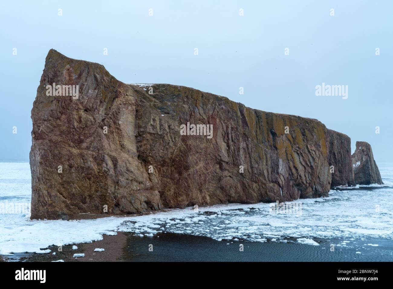 Percé Rock, a huge sheer rock formation in the Gulf of Saint Lawrence ...
