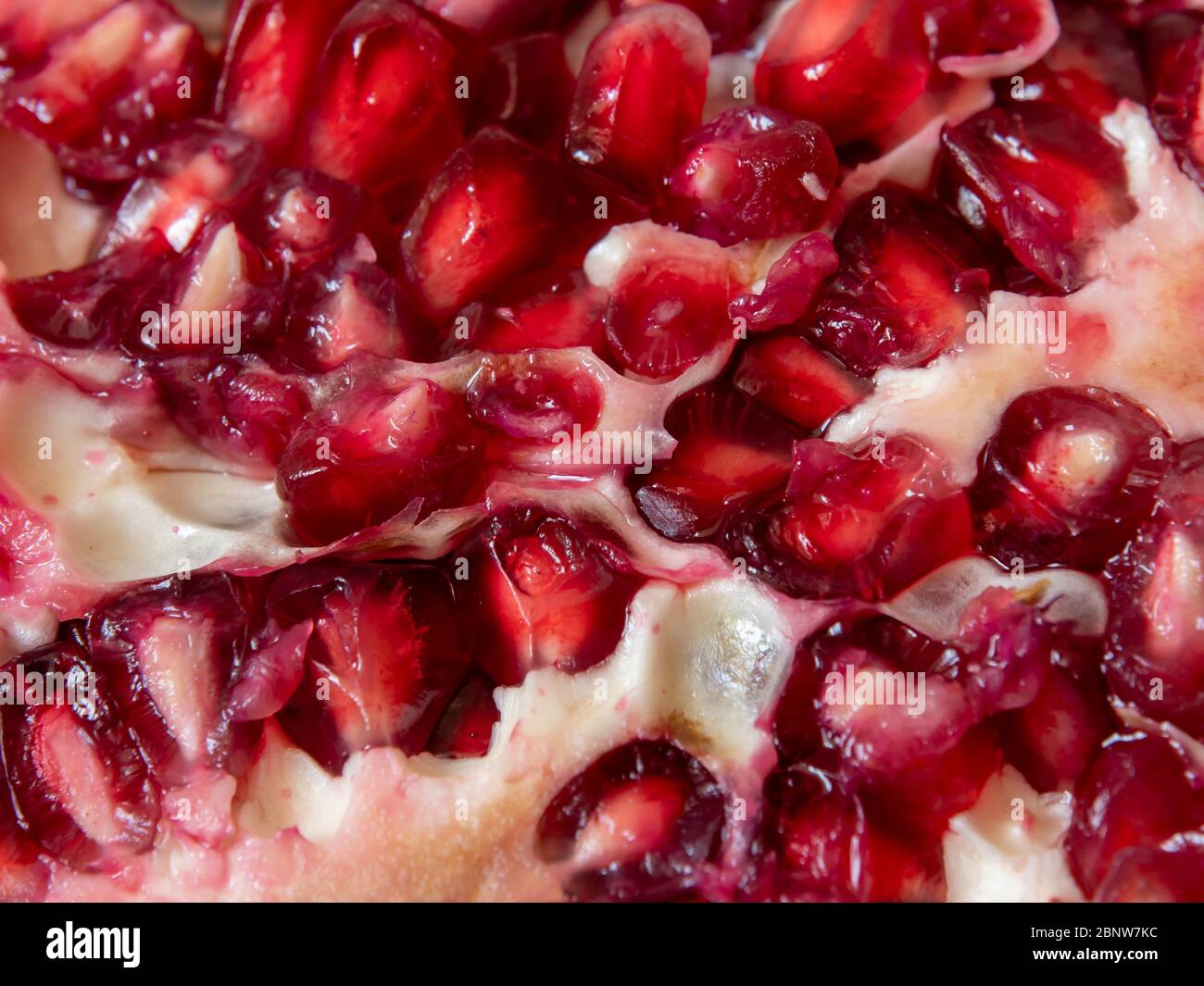 Pomegranate cut seeds close hi-res stock photography and images - Alamy