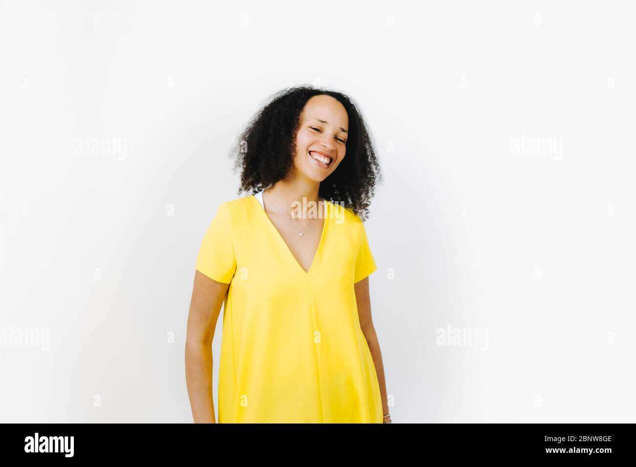 Woman in yellow shirt hi-res stock photography and images - Alamy