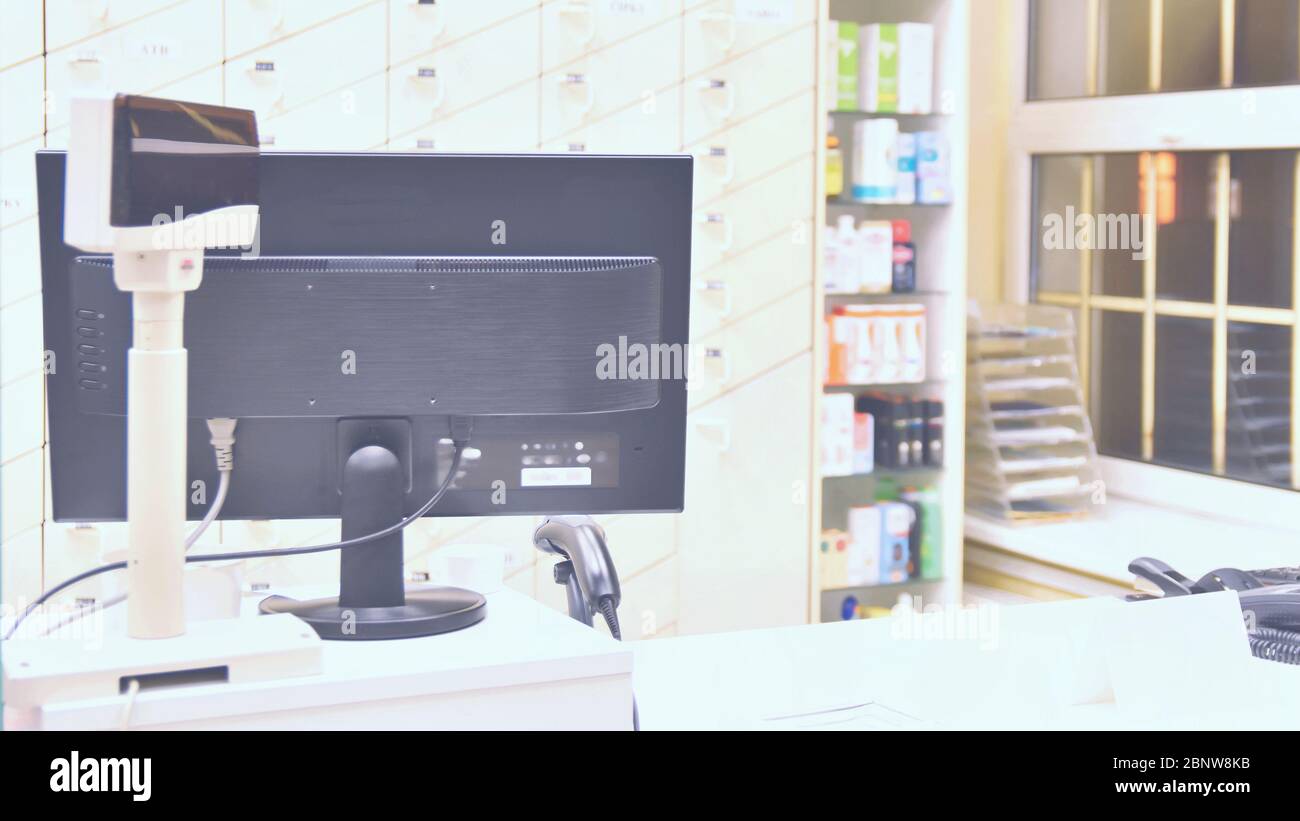 Cash desk - computer and monitor in a pharmacy. Interior of drug and ...